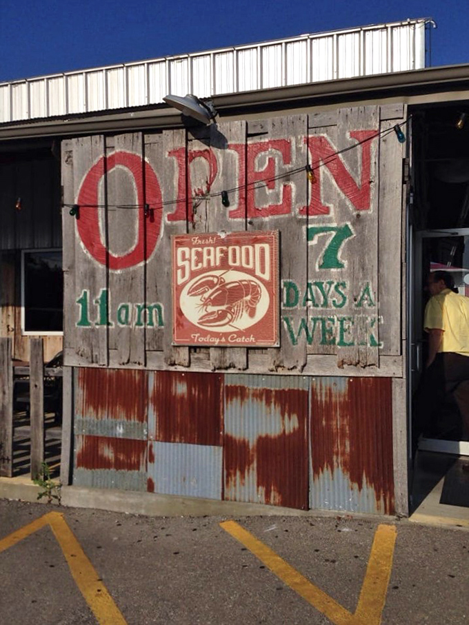 This isn't just a sign&mdash;it's a wooden promise of crispy, cornmeal-crusted happiness waiting inside.