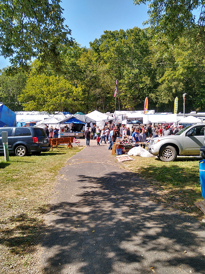A river of shoppers flows between tents at Friendship Market. Those wagons aren't for show&mdash;they're for hauling home the good stuff!