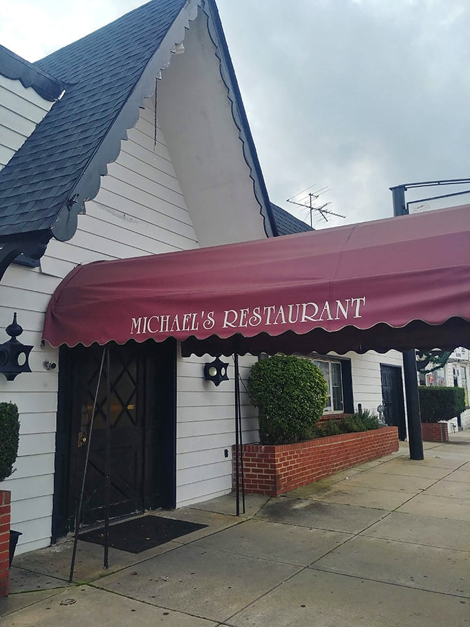 That burgundy awning marks the spot where steak dreams come true. Michael's proves fancy facades aren't required for fantastic flavor.