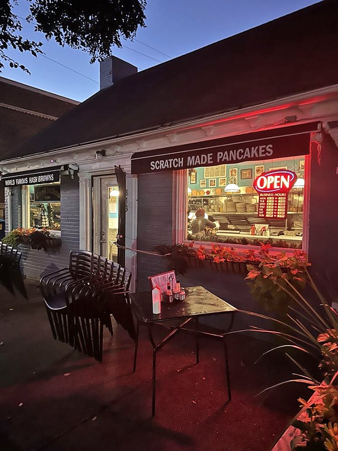 Our Kitchen evening view: "Twilight transforms this tiny blue breakfast spot into a cozy haven where pancakes are flipped with surgical precision."