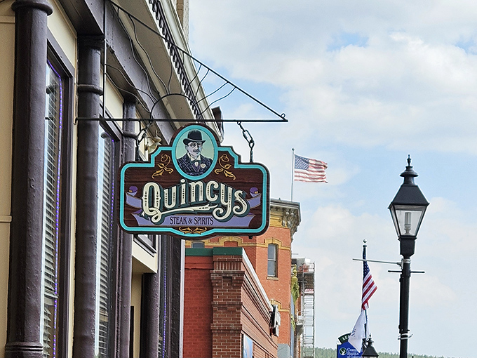 Quincy's (storefront): "Nestled between brick and history, this doorway leads to the kind of straightforward steak experience that never goes out of style."