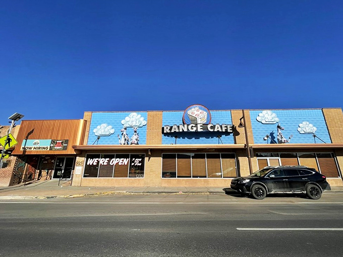 Cowboys and clouds dance across this colorful facade. The Range Cafe proves breakfast can be both art and science.