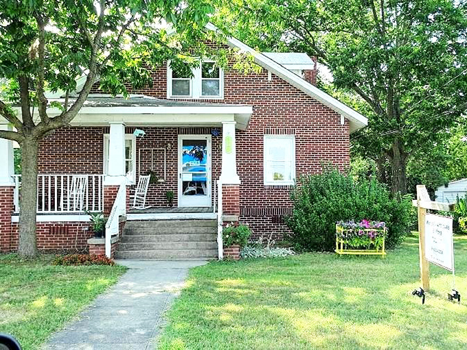 This charming brick home in Wendell represents the town's welcoming spirit. White porch columns practically beg you to sit a spell.