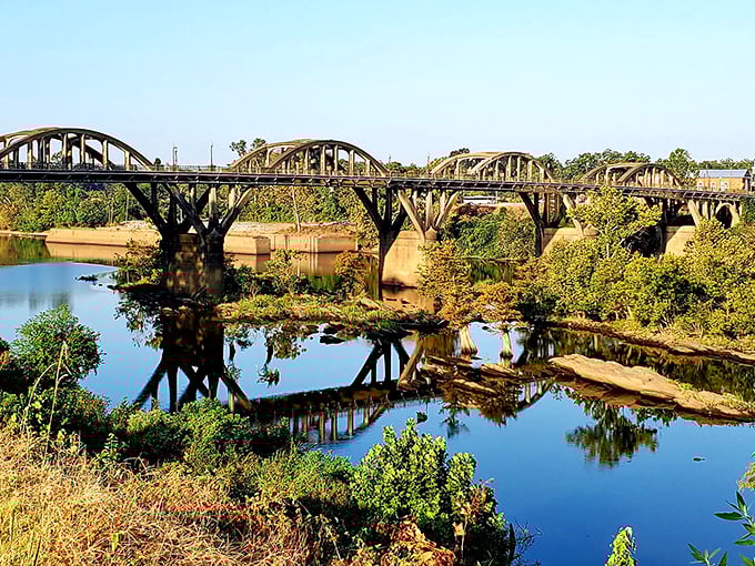The historic bridge spanning Wetumpka's Coosa River stands as both functional landmark and frame-worthy photo op. Engineering that knew how to dress up for company.