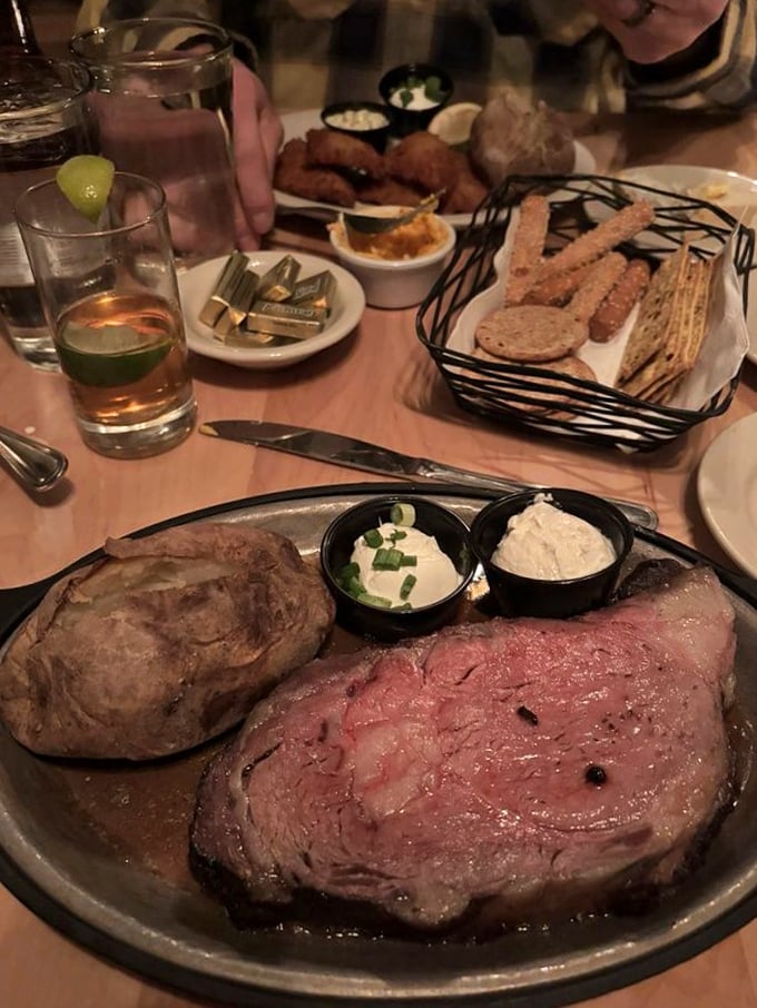 When your server sets this down, time stops. The aroma rises like a meaty serenade while the knife stands ready for its moment.