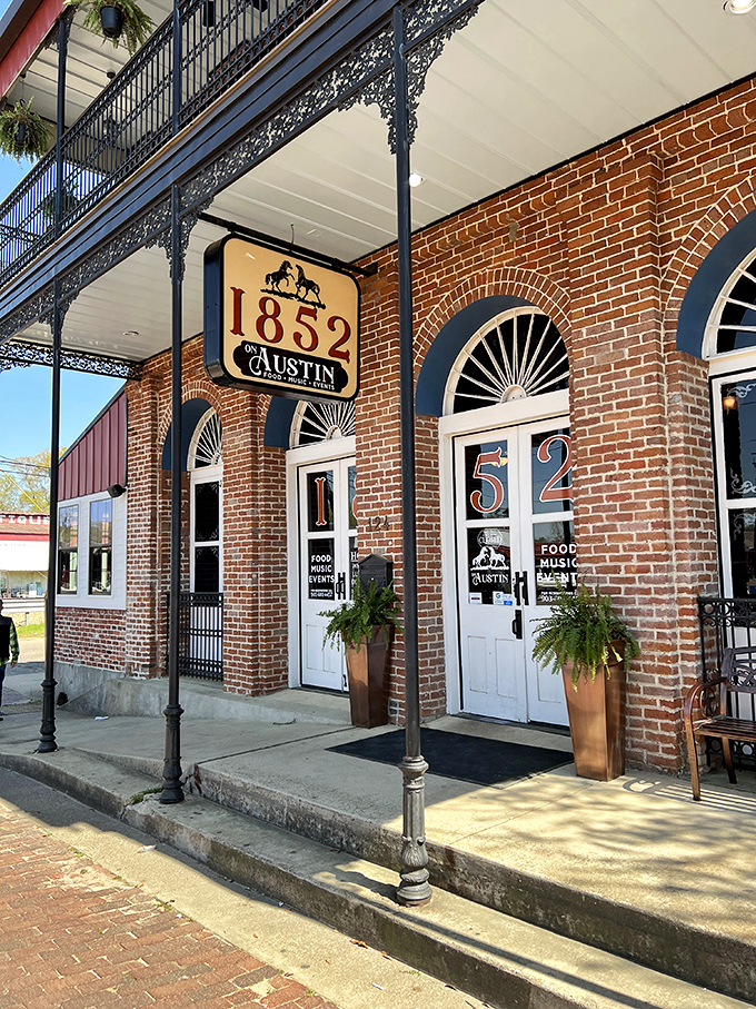 The 1852 on Austin building flaunts its ironwork balconies like Victorian-era bling, promising food and music behind those perfectly symmetrical doors.