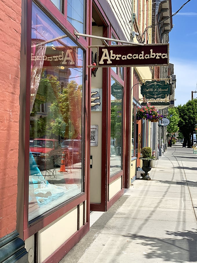 At Abracadabra, magic happens when artisanal crafts meet vintage treasures under the watchful gaze of colorful storefronts along Water Street.