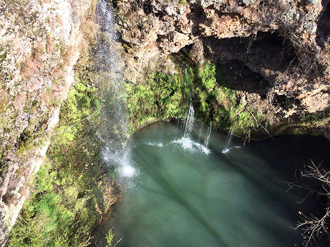 The waterfall's secret revealed from above &ndash; a thin ribbon of water that's spent millennia sculpting its own perfect swimming pool.
