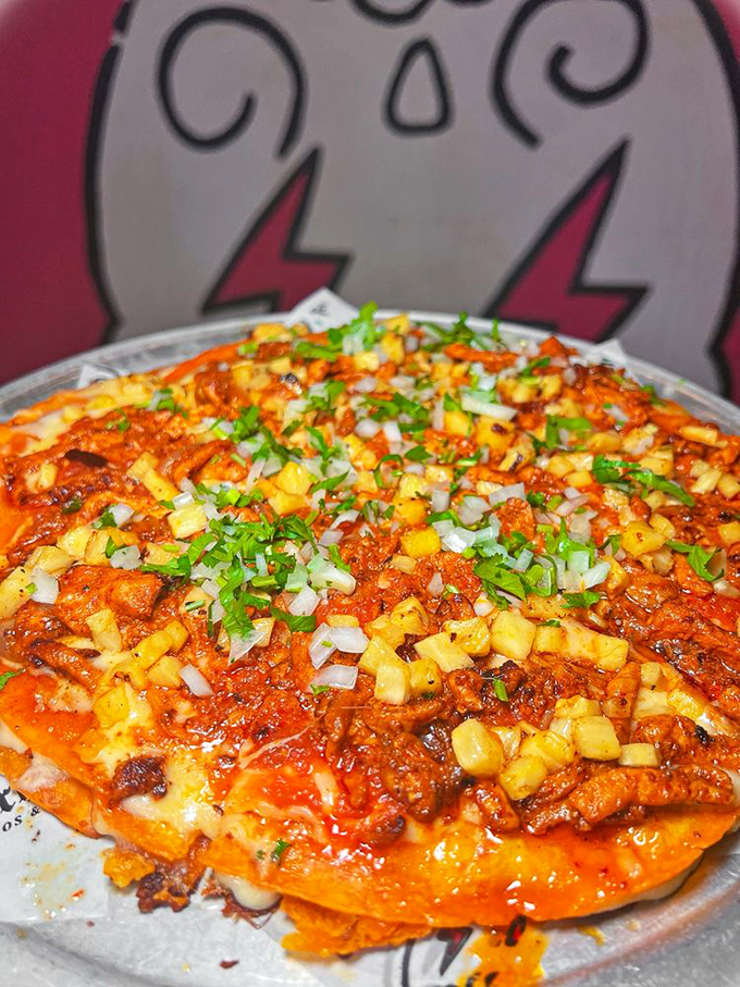 The "Birria Pizza" combines the best of two comfort food worlds, topped with enough cilantro and diced vegetables to almost count as a salad. Almost.