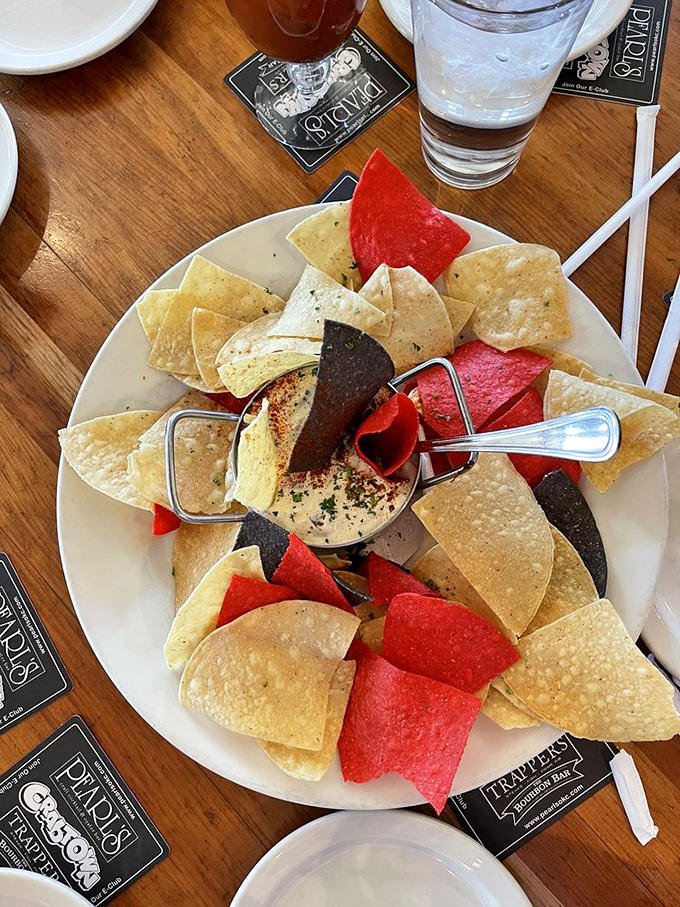 Hot crab dip surrounded by a rainbow of chips. It's like a party where the guest of honor is made of crab and cheese.