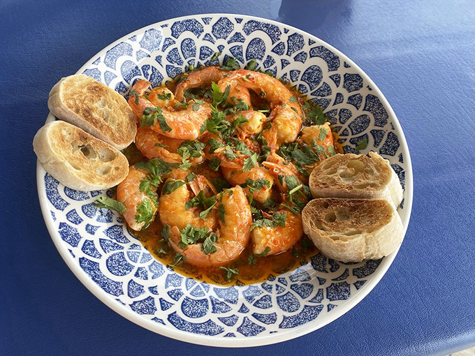 Shrimp bathed in a sauce worth bottling. The accompanying bread isn't a side&mdash;it's a crucial sauce-delivery system.