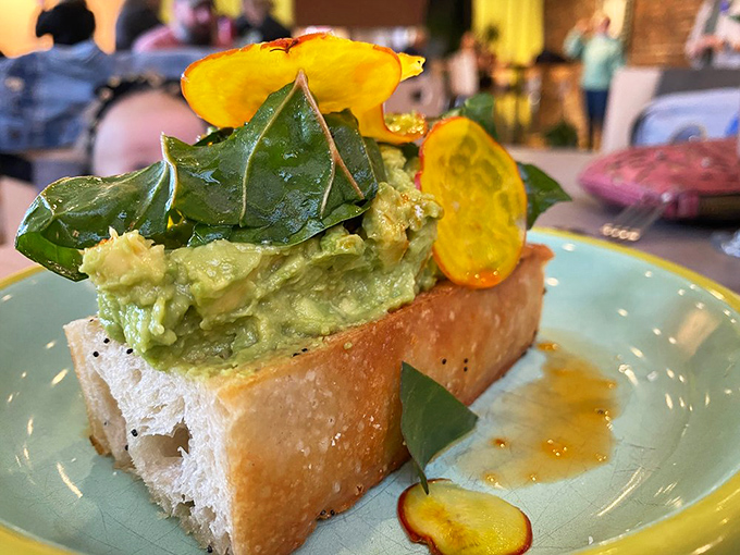 The Avo Tartine elevates avocado toast to an art form, with vibrant greens and golden beets that make healthy eating feel indulgent.