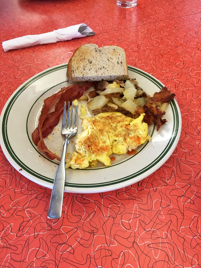 The breakfast trinity: eggs, bacon, and potatoes. This plate has fueled American mornings since before your grandparents' first date.