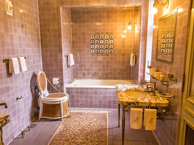 Even the bathroom exudes elegance with its lavender tiles and vintage fixtures&mdash;proving that early 20th-century plumbing could indeed be both functional and fashionable.