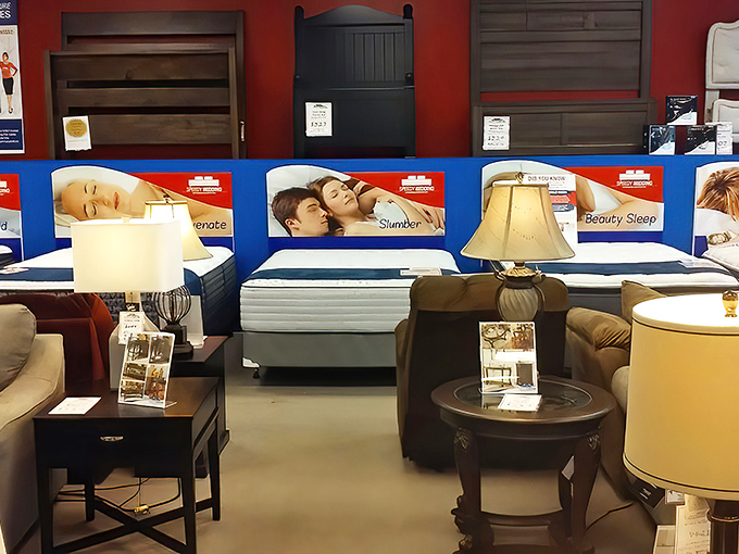 The mattress section meets the living room display in perfect harmony, like finding both dinner and dessert at your favorite neighborhood spot.