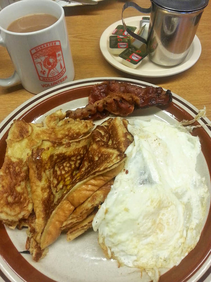 Breakfast doesn't get more honest than this. Eggs, bacon, and French toast forming the holy trinity of morning perfection.