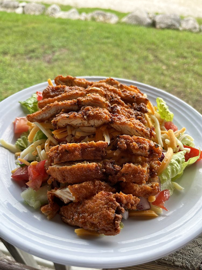 Crispy chicken meets garden-fresh salad in a dish that somehow manages to be both indulgent and virtuous. Your diet's delicious loophole.