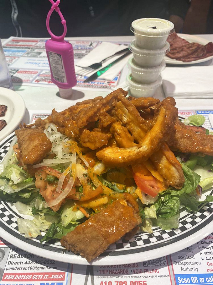 Buffalo chicken salad that solves the eternal dilemma: "I should eat healthy, but I want something fried." The answer? Do both, gloriously.