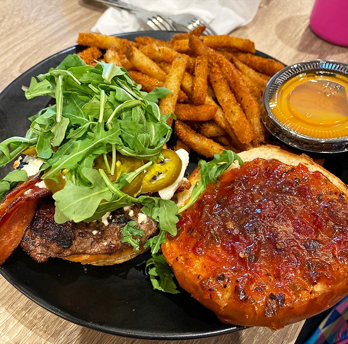 A burger that doesn't need a fancy introduction, just your undivided attention. Those seasoned fries are the backup singers who could be stars themselves.