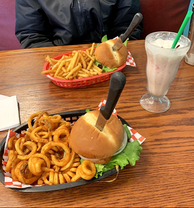 Curly fries that loop-de-loop around a burger that means business. That milkshake isn't just thick&mdash;it's practically standing at attention.