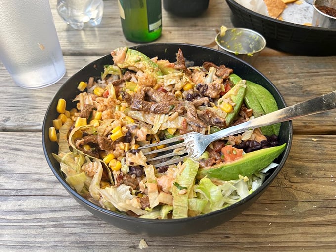 A fiesta in a bowl&mdash;seasoned meat, fresh veggies, and all the fixings create a colorful landscape you'll be sad to demolish.