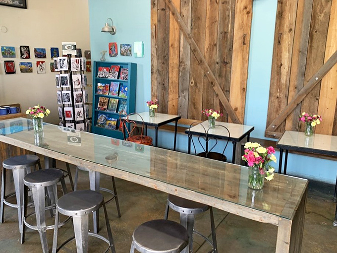The communal tables adorned with fresh flowers invite you to linger, making "grab and go" feel like a missed opportunity for donut-based fellowship.