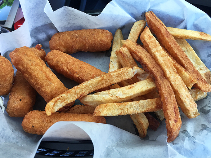 These golden mozzarella sticks are engaging in what philosophers call "the perfect pull"—that magical cheese stretch between bite and plate.