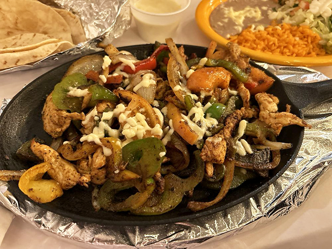 Sizzling fajitas that announce their arrival before you see them. That cast iron skillet isn't just cooking meat and peppers&mdash;it's creating memories.