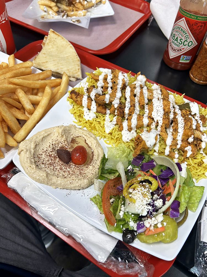 Chicken shawarma that makes you question why you ever ate anything else. The tzatziki zigzags aren't just pretty&mdash;they're tactical flavor deployment.