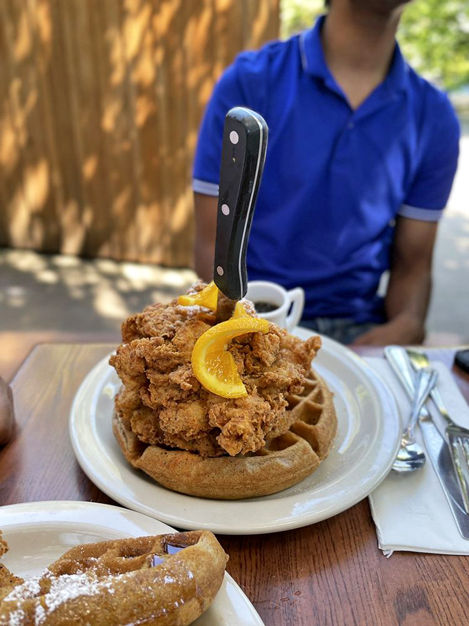 The legendary chicken and waffle tower&mdash;where fried chicken so perfect it makes you question reality meets a sweet potato waffle.