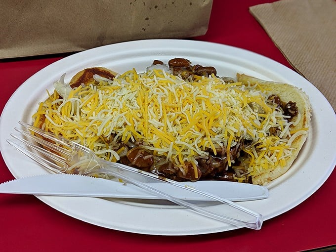 Mountains of cheese atop a hearty creation that proves some treasures require both hands and several napkins to fully appreciate.