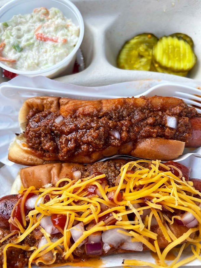 These hot dogs aren't messing around—smothered in homemade chili and crowned with cheese, they're comfort food royalty on a humble bun.