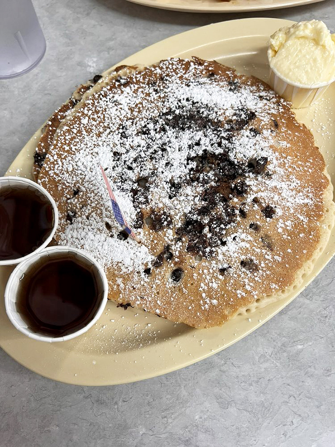 This pancake isn't just big&mdash;it's the size of a hubcap, dusted with powdered sugar and studded with chocolate chips like delicious polka dots.