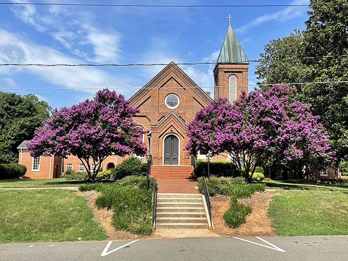 Framed by vibrant crepe myrtles, this historic brick church reminds visitors that Hillsborough's architectural heritage extends beyond its commercial district.