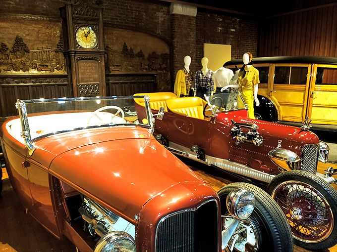 A vibrant display featuring mannequins dressed in period attire alongside their equally stylish automotive counterparts&mdash;fashion and function beautifully merged.