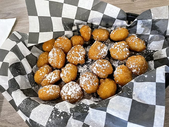 These golden hush puppies, dusted with powdered sugar, are what would happen if cornbread joined the circus. Crispy outside, fluffy inside&mdash;they disappear faster than your diet resolutions.