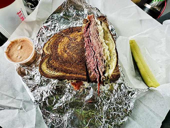 Not so much a sandwich as a monument to corned beef. The foil isn't containing it&mdash;it's presenting it.