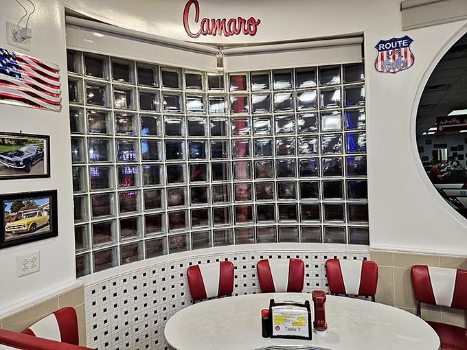 The "Camaro Corner" booth offers prime real estate for serious eaters. Car culture meets food culture in this nostalgic nook of the diner.