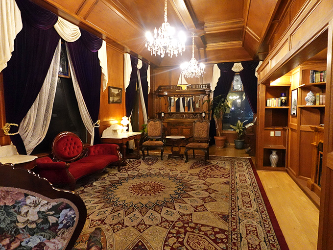 This room doesn't just say "Victorian luxury" &ndash; it shouts it through a velvet megaphone while lounging on that sumptuous red chaise.