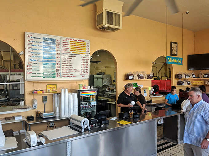 The ordering counter—where dreams are voiced, anticipation builds, and the staff efficiently orchestrates the symphony of New Mexican flavors behind them.