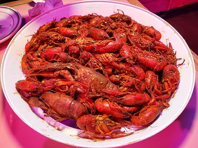 A mountain of crawfish that demands both dedication and napkins. These little red creatures are worth getting your hands dirty for.