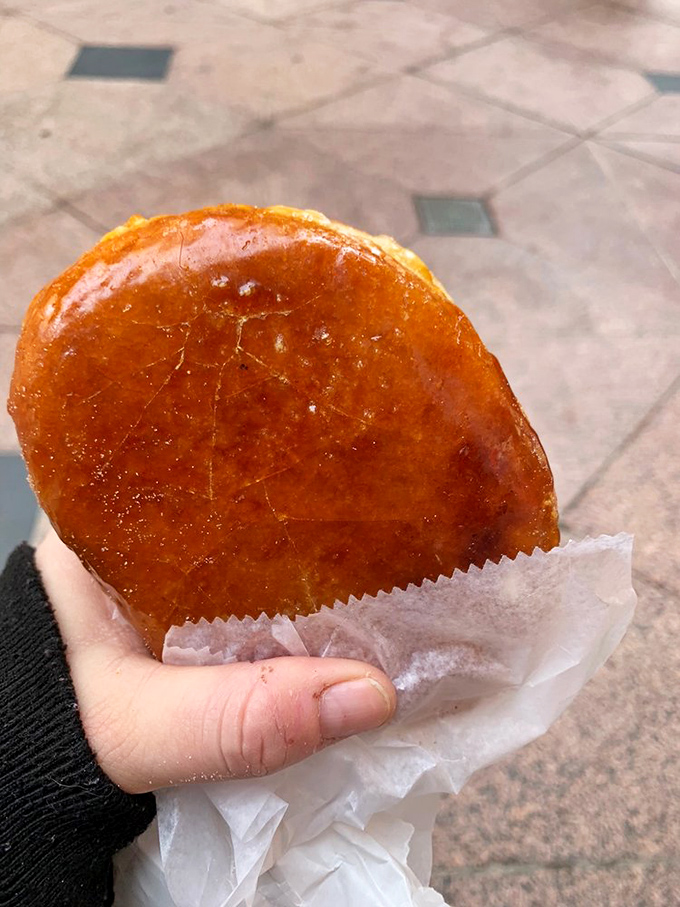 Like its French cousin, this cr&egrave;me br&ucirc;l&eacute;e donut proves that sometimes the best cultural exchanges happen in bakery display cases.