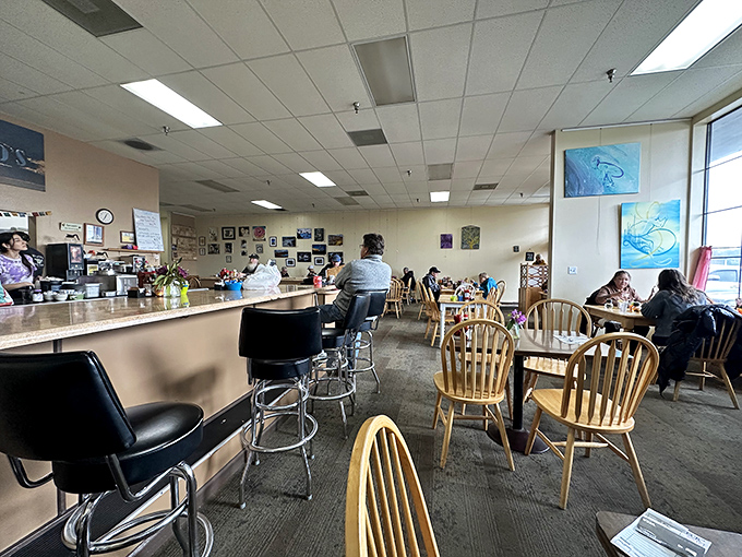The dining room where strangers become neighbors over shared maple syrup and coffee refills. Democracy in action, one breakfast at a time.