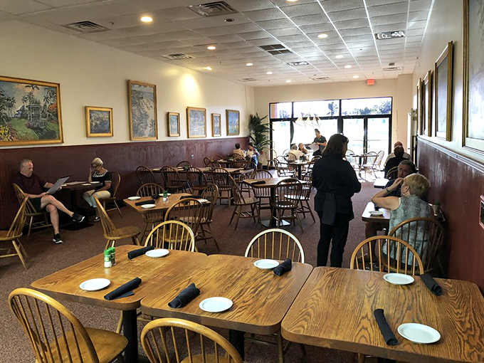 A dining room where conversations flow as easily as the wine, with artwork that reminds you you're dining in coastal Florida.