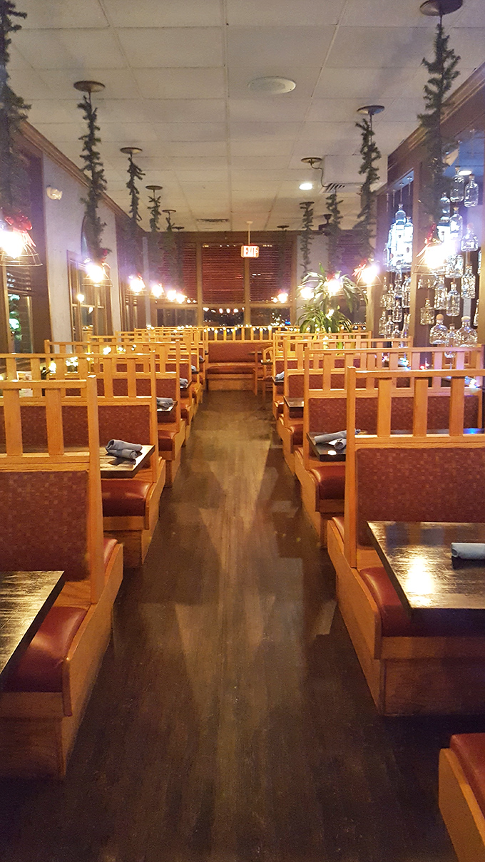 The dining room's warm wooden booths practically whisper, "Stay awhile, order another round, the outside world can wait."