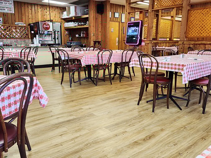 The dining room at Notini's&mdash;where the wooden chairs have supported generations of happy eaters and the lattice dividers have witnessed countless first dates.