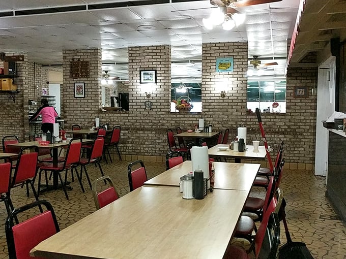 Red chairs aren't just for sitting—they're reserved for the fortunate souls about to experience breakfast bliss in this no-frills dining room.