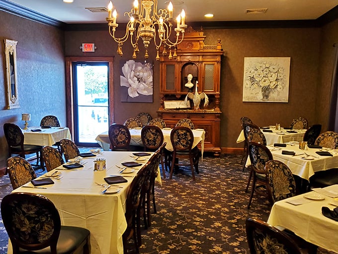 Dining rooms that balance elegance with comfort&mdash;white tablecloths say "special occasion" while the warm lighting whispers "relax, you're among friends."