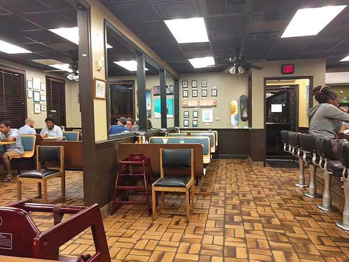 Classic diner aesthetics with blue booth seating and brick floors. The stage is set for memorable meals and conversations that linger longer than the check.