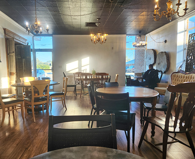 Sunlight streams through windows illuminating wooden tables where countless conversations have unfolded over perfect cups of coffee.